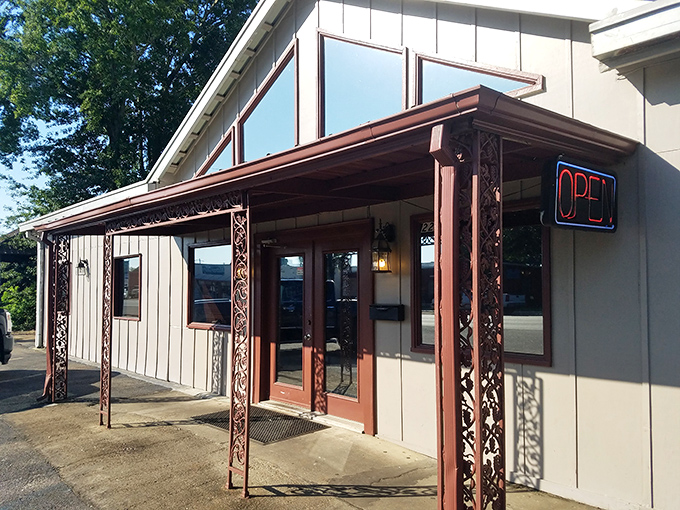 The café's charming roadside presence draws locals and travelers alike. Those parked cars aren't coincidental—they're pilgrims at the altar of perfect biscuits.