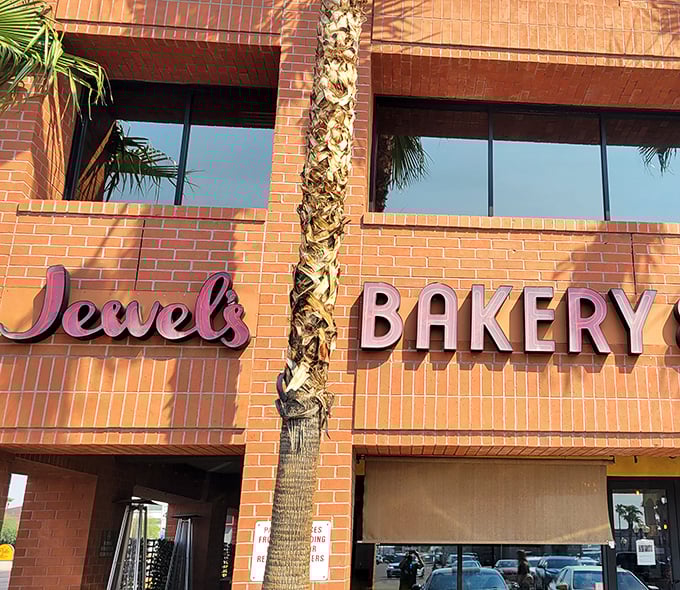 Palm trees and pink signage—a quintessential Arizona welcome that hints at the sweet and savory treasures waiting inside Jewel's doors.