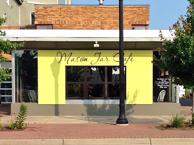 The sunshine-yellow facade of Mason Jar Cafe stands out like a breakfast beacon in Benton Harbor's Arts District. Morning magic awaits inside!