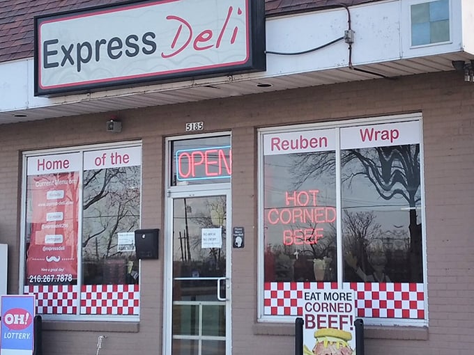The unassuming storefront that houses sandwich greatness. That red and white checkered trim isn't just decoration—it's a bat signal for sandwich lovers everywhere.