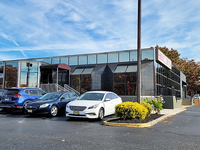 The Shore Diner's sleek exterior gleams in the autumn sunlight, promising comfort food treasures within. Like finding a designer suit at a thrift store—unassuming but extraordinary.
