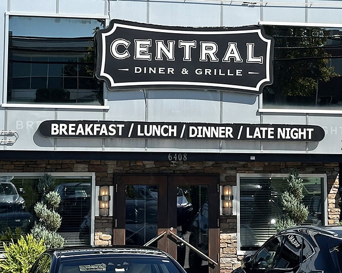 The classic black and white signage promises what every great neighborhood spot should: breakfast, lunch, dinner, and those magical late-night meals when nothing else will do.