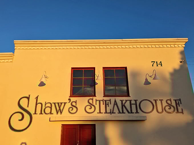 The golden facade of Shaw's Steakhouse glows in the late afternoon sun, like a beacon calling hungry travelers home.