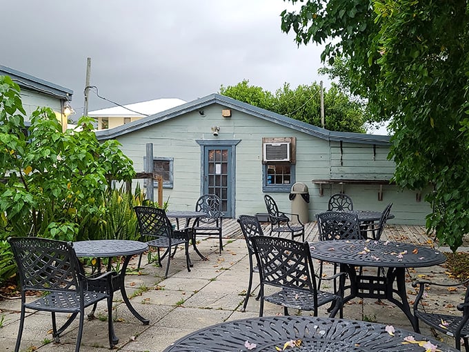 The unassuming aqua exterior of Cap's Place hides a treasure trove of Florida history and seafood delights waiting just beyond those weathered doors.
