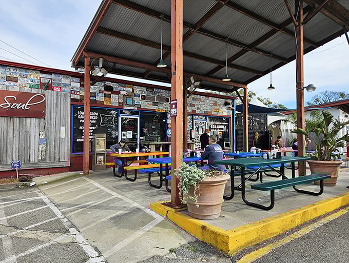 The converted gas station exterior says it all—unpretentious, welcoming, and promising smoky delights under that metal roof. BBQ paradise found!