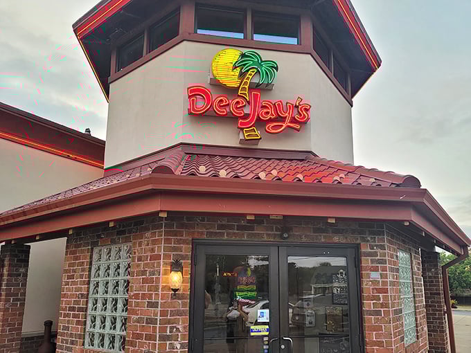 The iconic Dee Jay's exterior stands like a tropical oasis in Weirton, its neon palm tree logo promising a flavor vacation just beyond those doors.