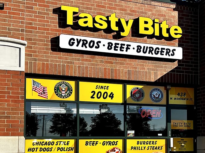 That classic yellow-and-brick exterior isn't just nostalgic—it's a time portal to when restaurants proudly displayed their military support alongside their menu specialties.