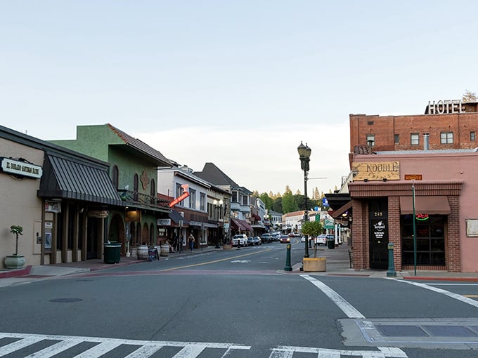 Main Street at dusk proves some towns age like fine wine – better with every passing decade.