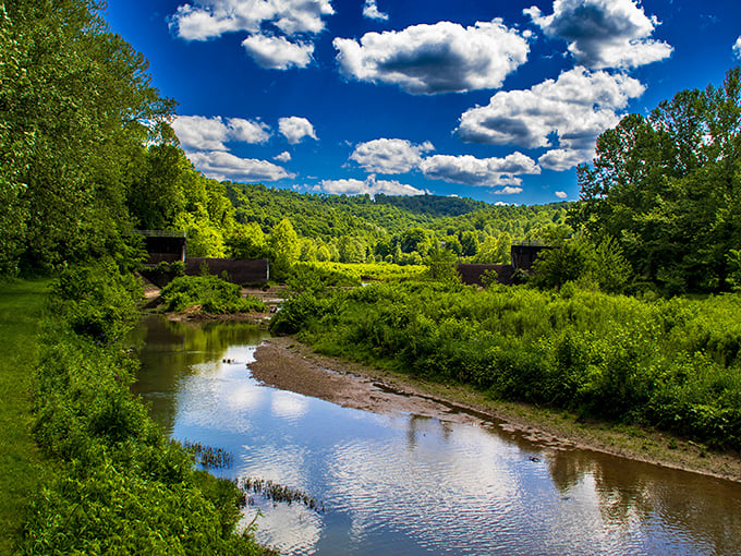Mother Nature showing off her best work—crystal clear stream reflecting puffy clouds against an impossibly blue Pennsylvania sky. No filter needed for this screensaver-worthy scene.