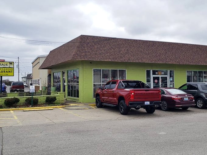 That cheerful green exterior isn't trying to blend in—it's announcing itself like a delicious beacon of Mediterranean hope.