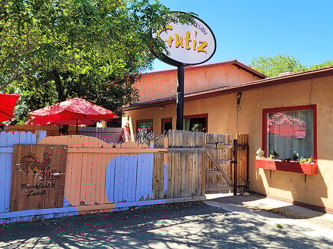 The unassuming salmon-colored adobe exterior of Gutiz hides culinary treasures like a piñata conceals candy. Those red umbrellas promise shade for sun-drenched diners.