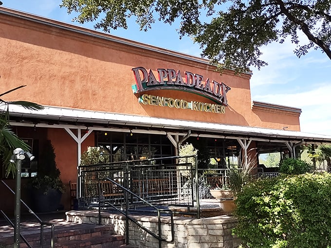 The terracotta-colored exterior of Pappadeaux stands like a mirage in the desert—a seafood oasis promising coastal treasures in landlocked New Mexico.