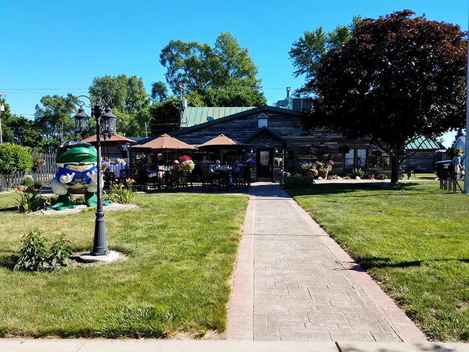A wide-angle view showing the full approach to this woodland dining oasis. Those umbrellas aren't just for show—they're reserving prime real estate.