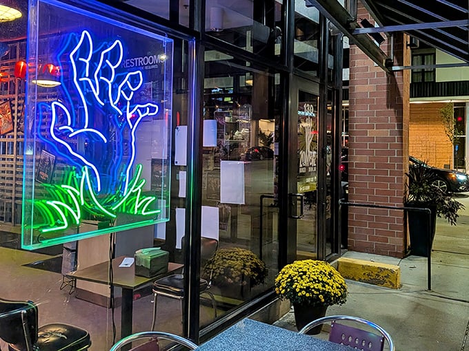 That neon zombie hand in the window isn't just decoration—it's beckoning you toward burger nirvana. Resistance is futile, and delicious.