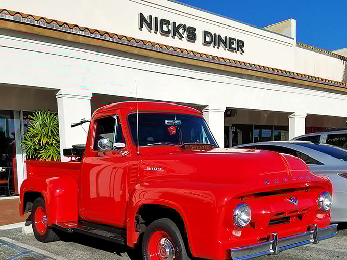 That classic Ford pickup isn't just decoration—it's a time machine parked outside, preparing you for the nostalgic journey waiting inside these doors.