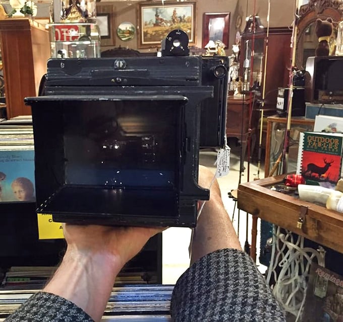 Someone's holding what appears to be a vintage camera—proof that Instagram filters are just pale imitations of what real photographers achieved with actual skill.