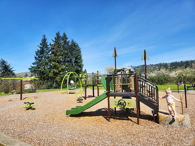 Micelli Park adventures unfold while parents relax nearby, remembering when "helicopter parenting" just meant toy helicopters.