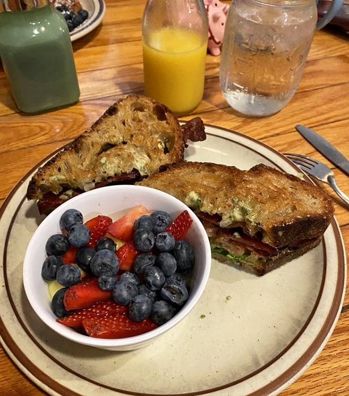 This sandwich and berry bowl combo isn't just breakfast—it's edible artwork that somehow manages to be both virtuous and decadent.