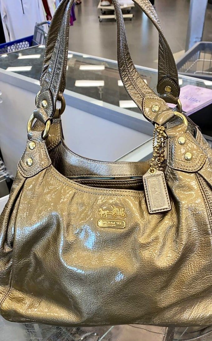 That's not just any handbag—it's a genuine Coach waiting for its second act. Luxury finds hiding in plain sight for the patient hunter.