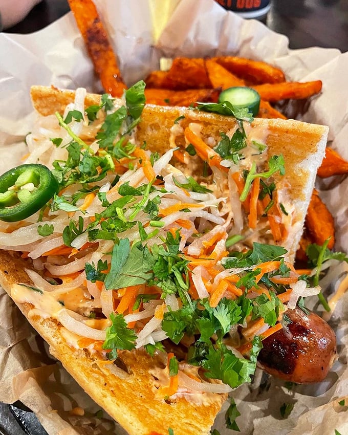 East meets West in this Vietnamese-inspired dog where fresh herbs, pickled vegetables, and jalapeños create a refreshing counterpoint to the savory sausage beneath.