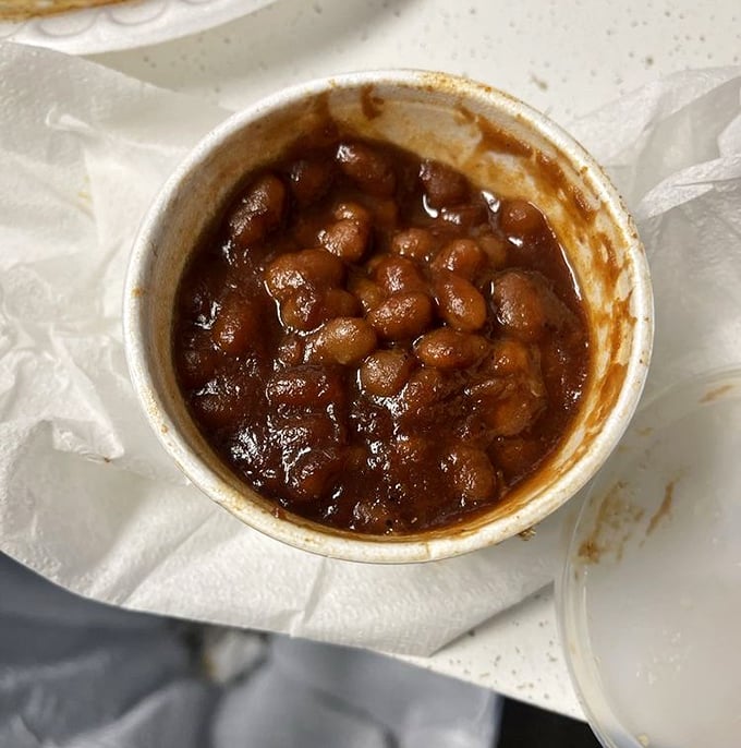Baked beans swimming in a molasses-rich sauce. These aren't your campfire beans—they've graduated to gourmet territory with smoky depth.