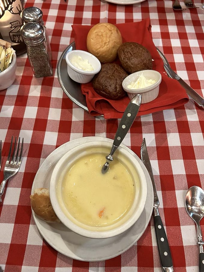 Comfort in a bowl—beer cheese soup alongside fresh-baked rolls. Pioneers may have dreamed of such luxury during long winter nights.