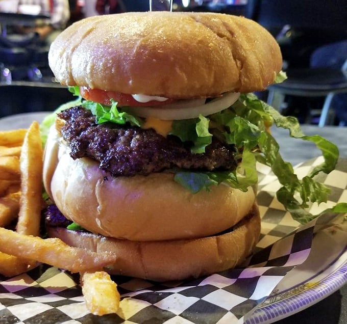 The classic burger in its purest form—proof that sometimes simplicity is the ultimate sophistication, especially when that simplicity includes a perfectly charred patty.