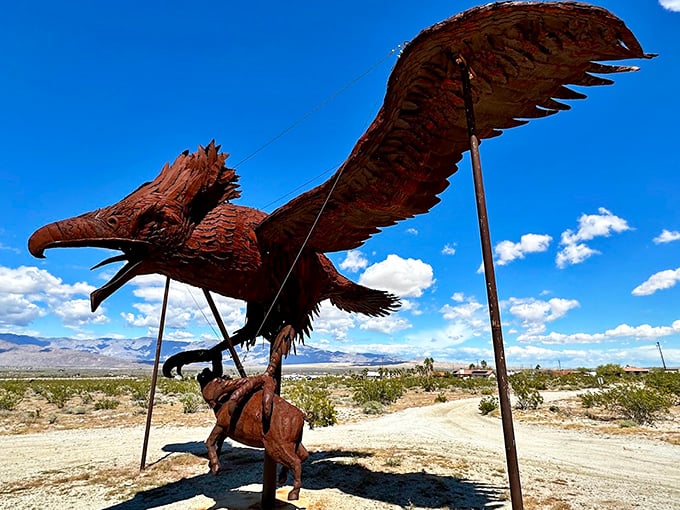 Nature's drama unfolds in metal—an eagle triumphantly carries its prey, suspended in an eternal moment of wild survival.