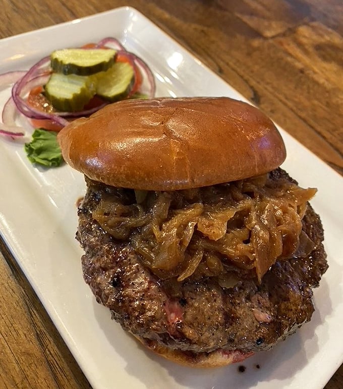The Bison Burger topped with caramelized onions is the sophisticated cousin in the burger family—leaner, more complex, but still knows how to party.