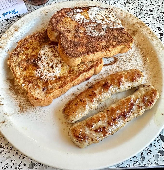 French toast that's been kissed by cinnamon and served alongside a sausage link that means serious breakfast business.
