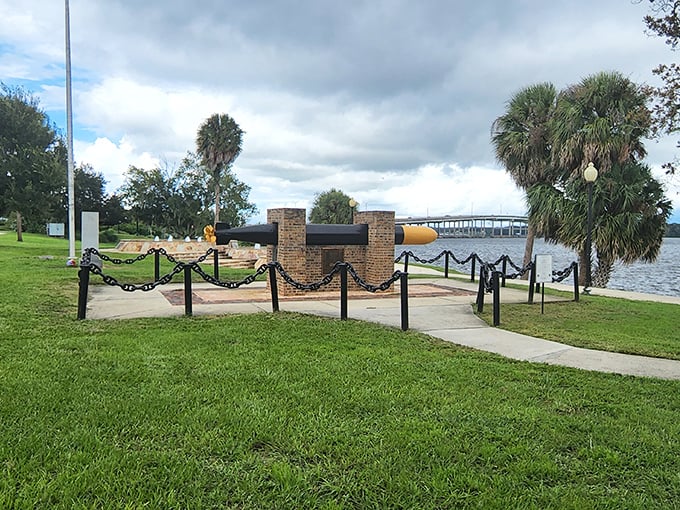 A piece of history stands guard by the riverfront – a silent reminder of Palatka's maritime heritage against the backdrop of modern bridges.