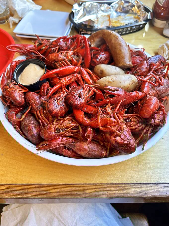 A mountain of boiled crawfish that requires both strategy and stamina—the most delicious work you'll ever do.