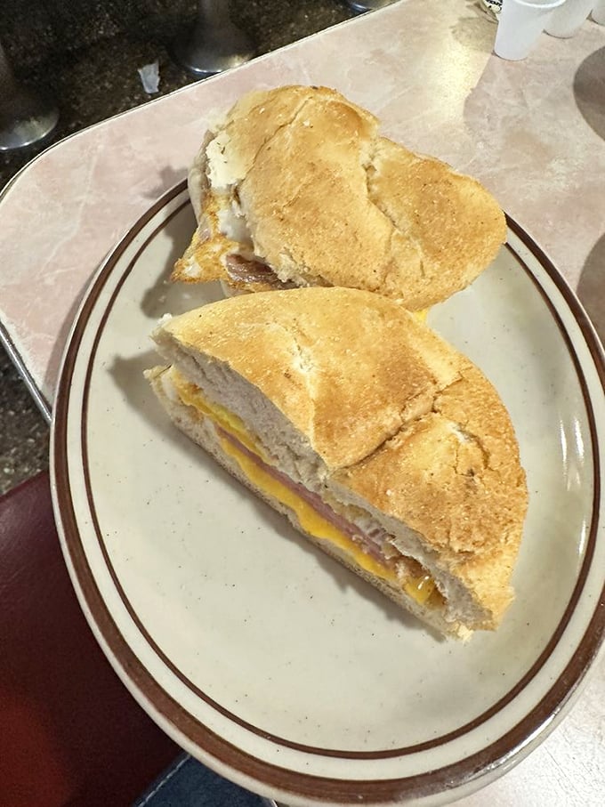 The humble breakfast sandwich, elevated to an art form. Melted cheese creates the perfect bond between egg, meat, and bread—a holy trinity of morning satisfaction.