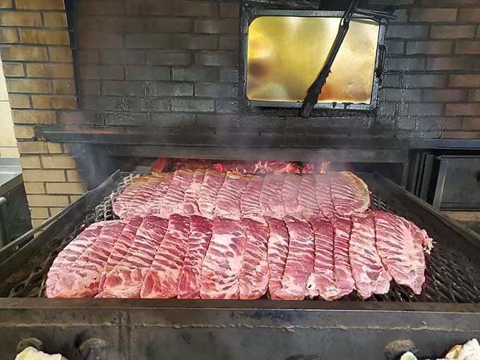 Behind the scenes where the magic happens. That brick smoker has probably seen more meat than a butcher's convention.