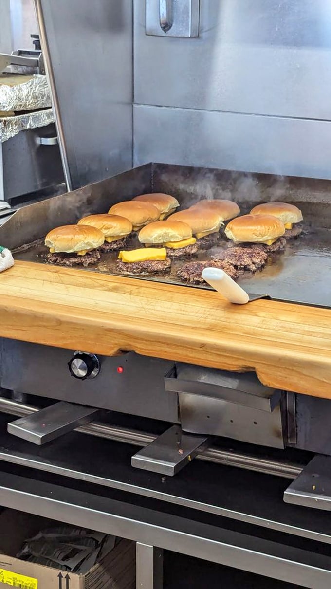 Burger alchemy in progress—watching these patties transform on the flat-top grill is the kind of food theater that needs no Broadway ticket.