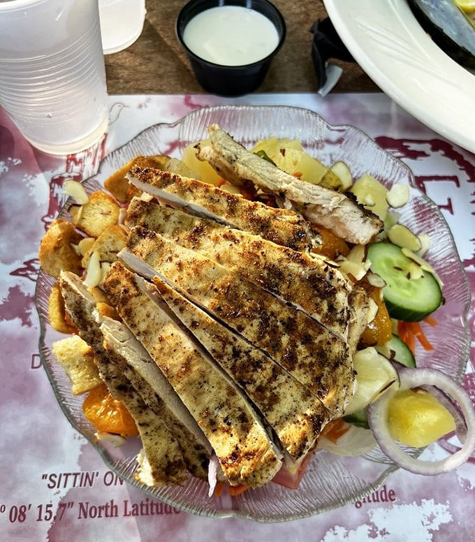 Grilled chicken atop fresh greens—proof that Smugglers' Wharf knows how to treat the occasional landlubber with equal culinary respect.
