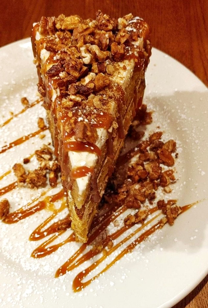 This carrot cake stands tall like a sweet skyscraper, topped with enough pecans to make Georgia jealous.