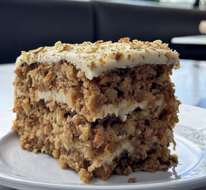Carrot cake that somehow manages to convince you it's a vegetable serving while delivering three layers of cream cheese-frosted bliss.