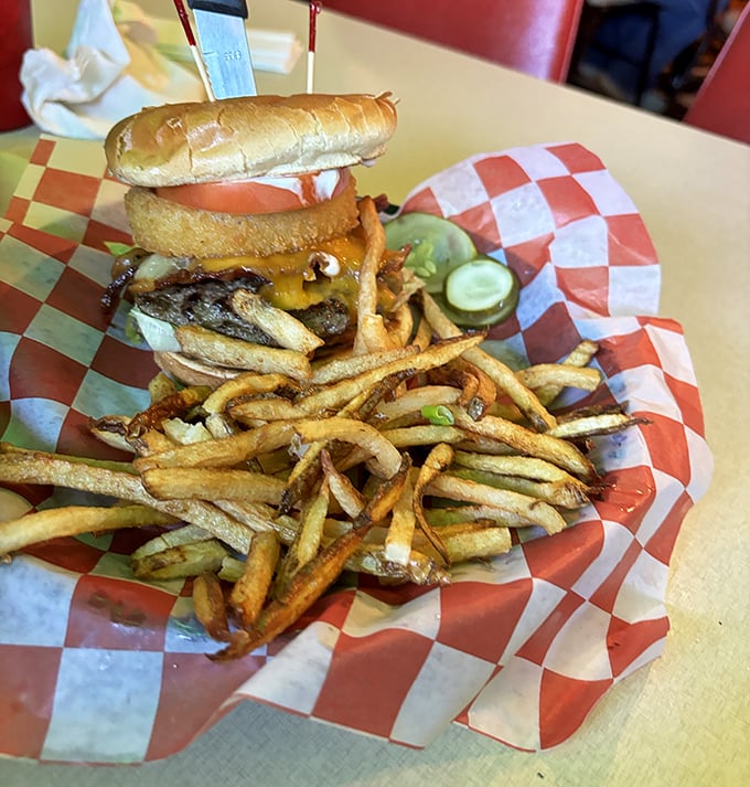 This burger isn't just a meal, it's an engineering feat. Those hand-cut fries are playing the long game—thin enough to crisp, substantial enough to satisfy.