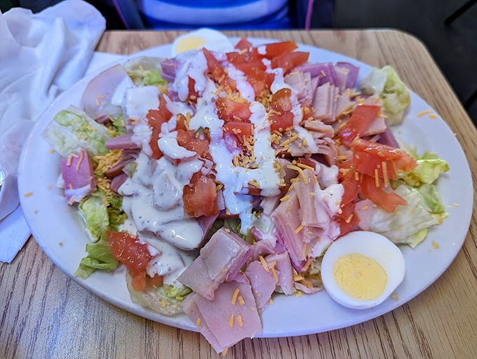 A chef salad that doesn't apologize for being exactly what it is—a hearty, satisfying arrangement of proteins, veggies, and that perfect hard-boiled egg.