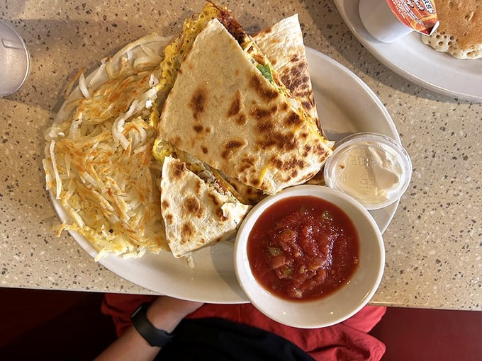A quesadilla that doesn't skimp on the fillings, served with a side of crispy hash browns. Breakfast with a Tex-Mex twist.
