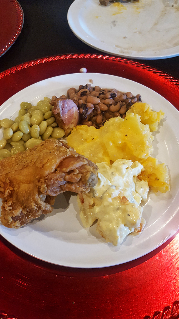 The kind of plate that makes you want to invent new words for delicious—fried chicken, field peas, and mac and cheese in perfect harmony.
