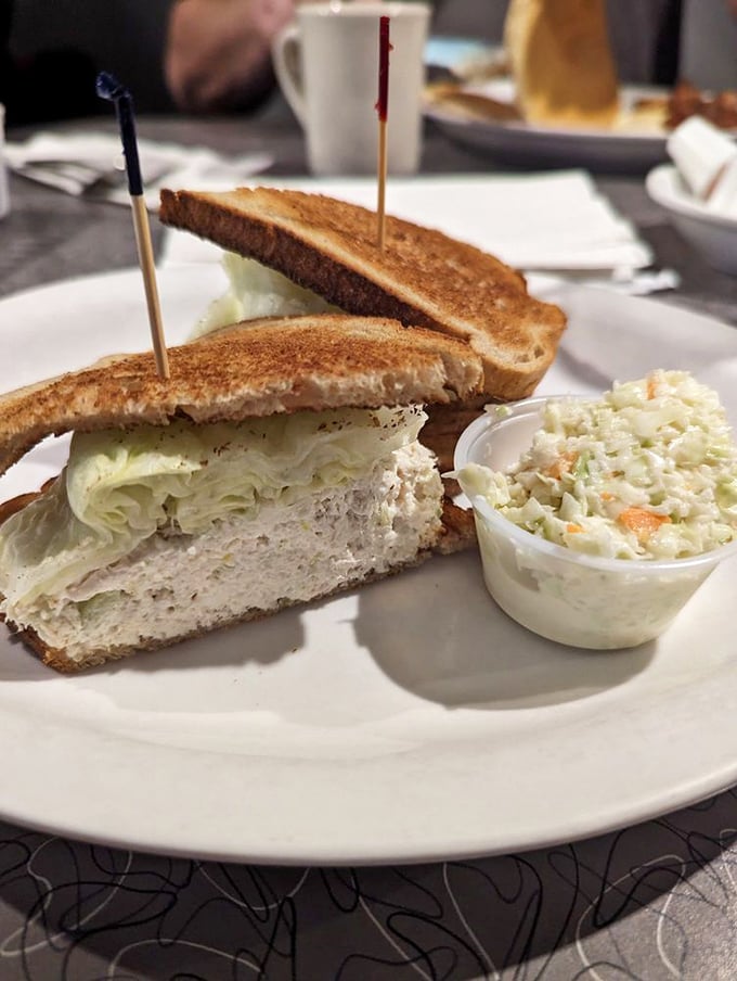This chicken salad sandwich isn't playing around – it's the heavyweight champion of lunch, with coleslaw as its trusty cornerman.