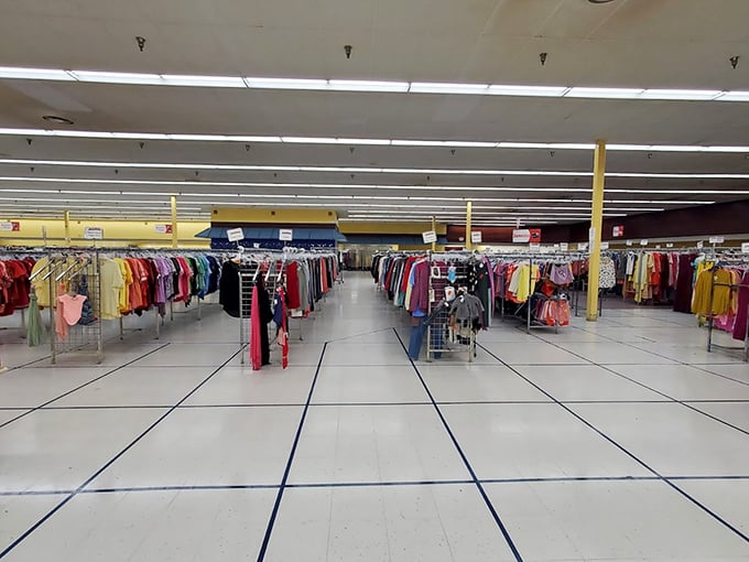 The perspective down this clothing canyon reveals the true scale of Mega Thrift—less store, more indoor city of secondhand splendor.