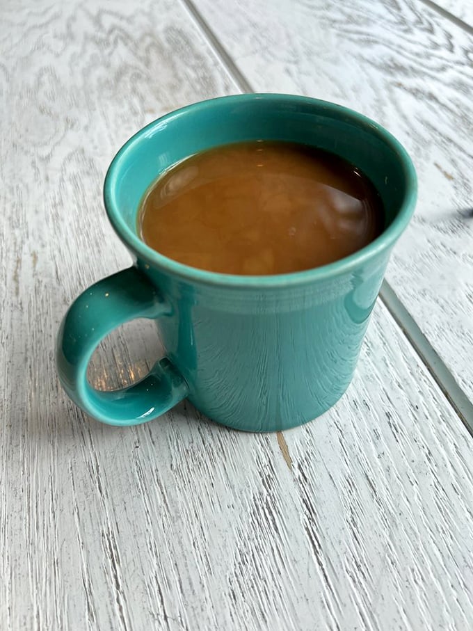 Simple turquoise mug filled with proper coffee—sometimes the best moments arrive in the most unassuming packages.