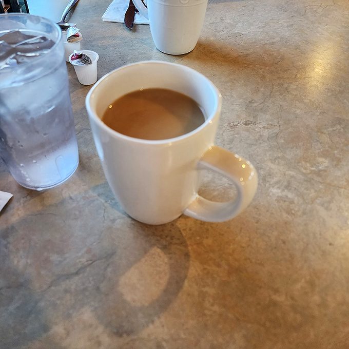 The humble coffee mug – faithful companion to countless conversations, newspaper readings, and contemplative morning moments at Reececliff's tables.