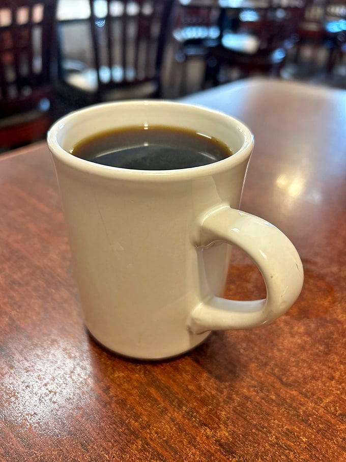 The humble white coffee mug—civilization's greatest achievement and the unsung hero of every diner experience across America.