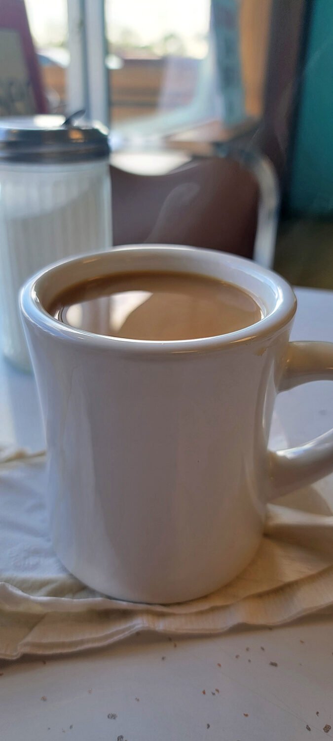 Coffee served in proper mugs because some things shouldn't change, especially when they're done right.