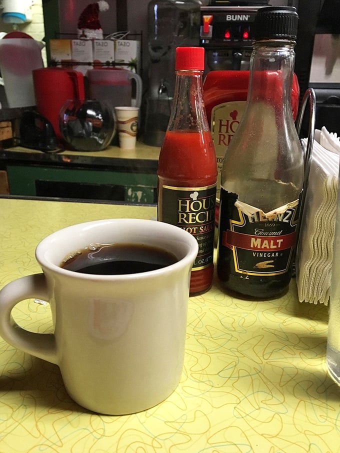 That classic white mug holds more than just coffee—it contains the lifeblood of diner culture and comes with unlimited refills of nostalgia.