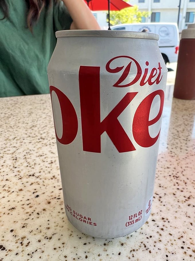 The obligatory Diet Coke—because balance is important when you're about to consume a burrito the size of your forearm.